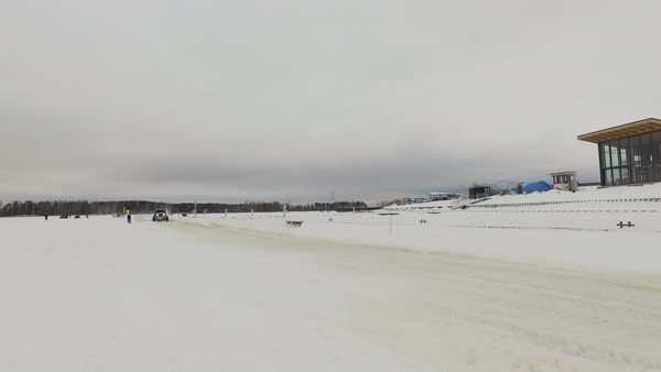 Winter racing side-by-side vehicles. Rally on the buggy on the snow on ...