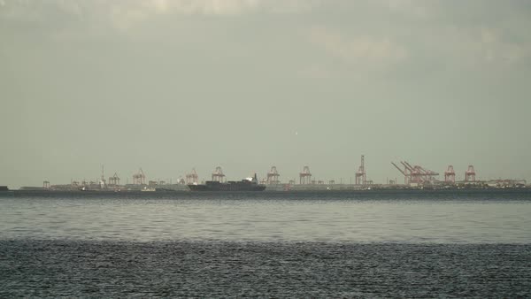 Cargo ship with containers floating on the sea. Cargo ships in the Bay ...
