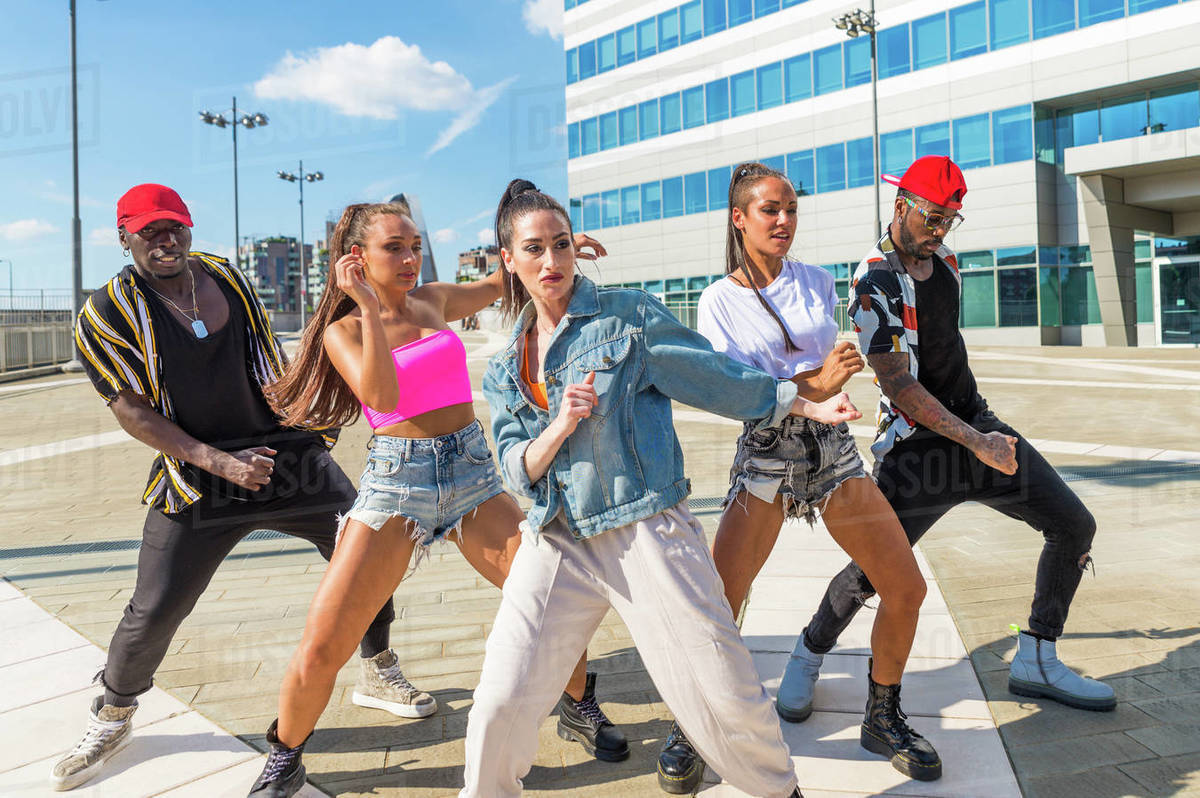 Hip hop crew dancing - Multiracial group of people having fun outdoors ...