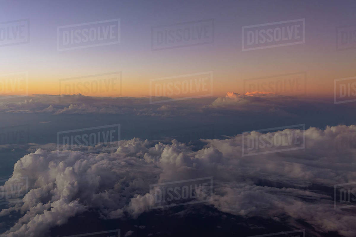 View from airplane beautiful sunset sky above clouds with dramatic ...