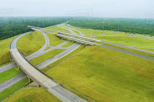 Misty morning over a desolate country road with bridge across US 65 ...