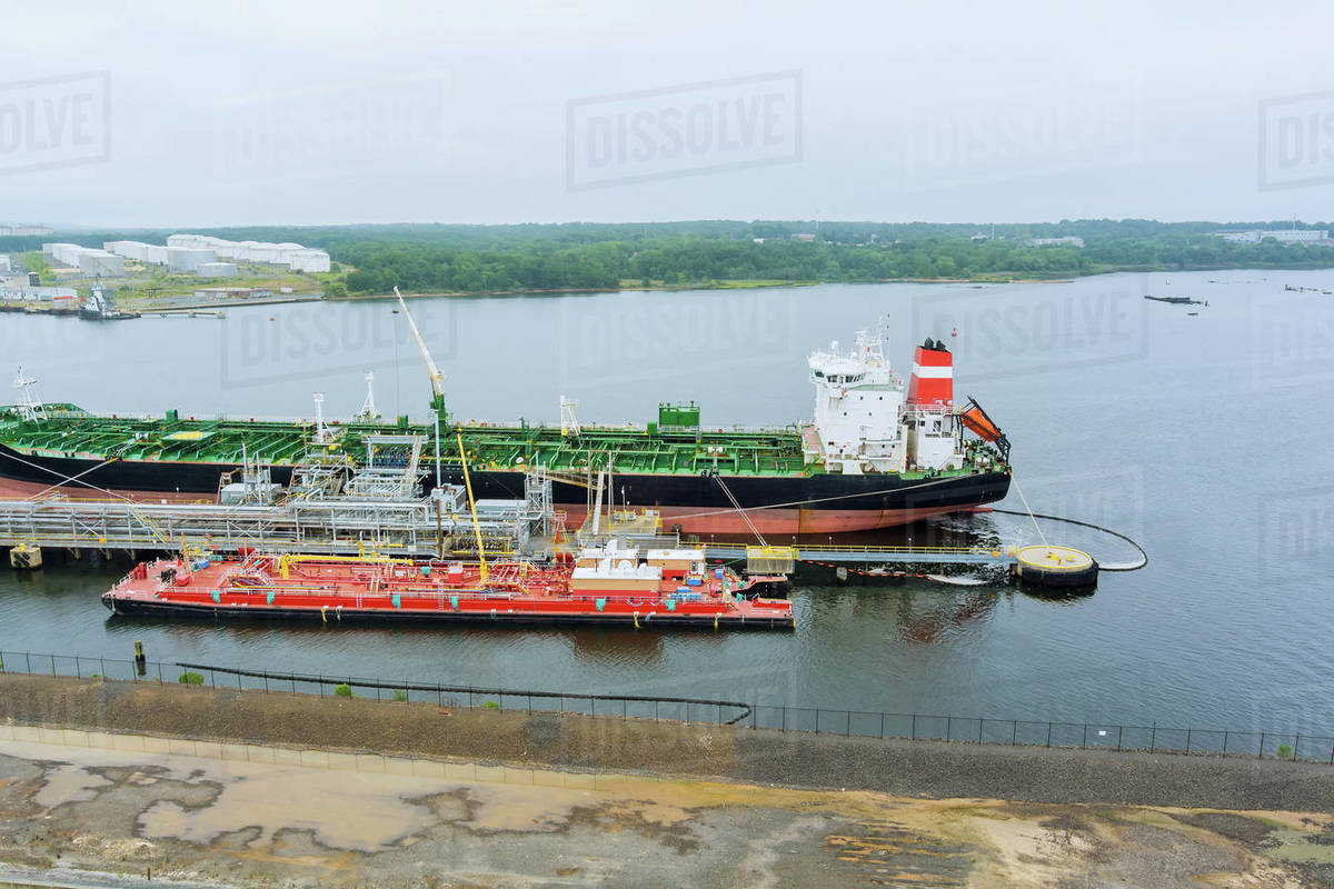 Aerial top view cargo operations huge oil tanker ship operation during ...