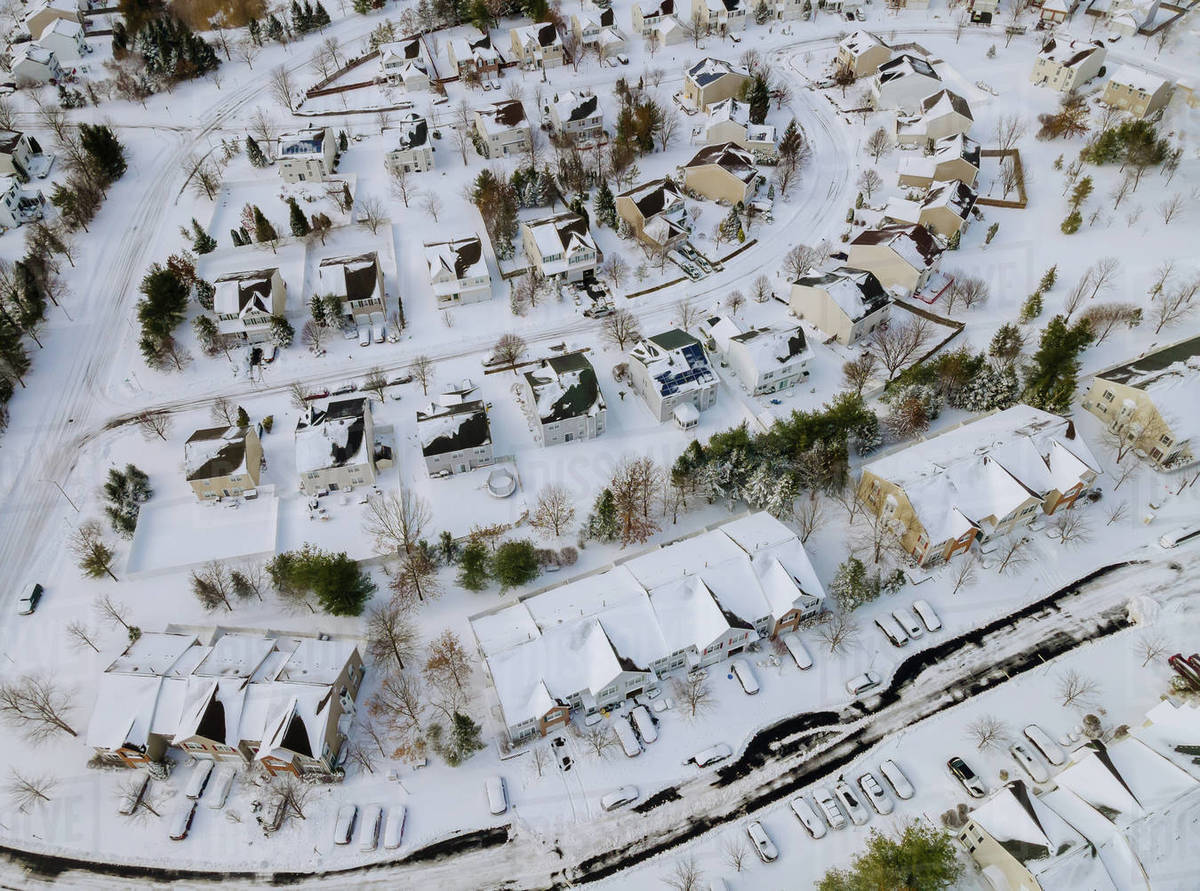 High altitude view of a town's residential neighborhood with snow ...