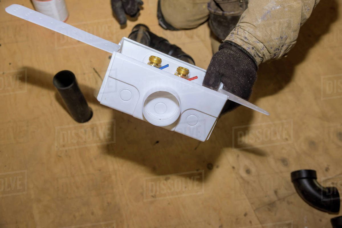 Installation of a laundry outlet boxes in a new house for connection of ...