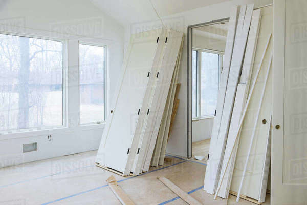 Interior wooden stacker door installation,apartment building, a wait ...