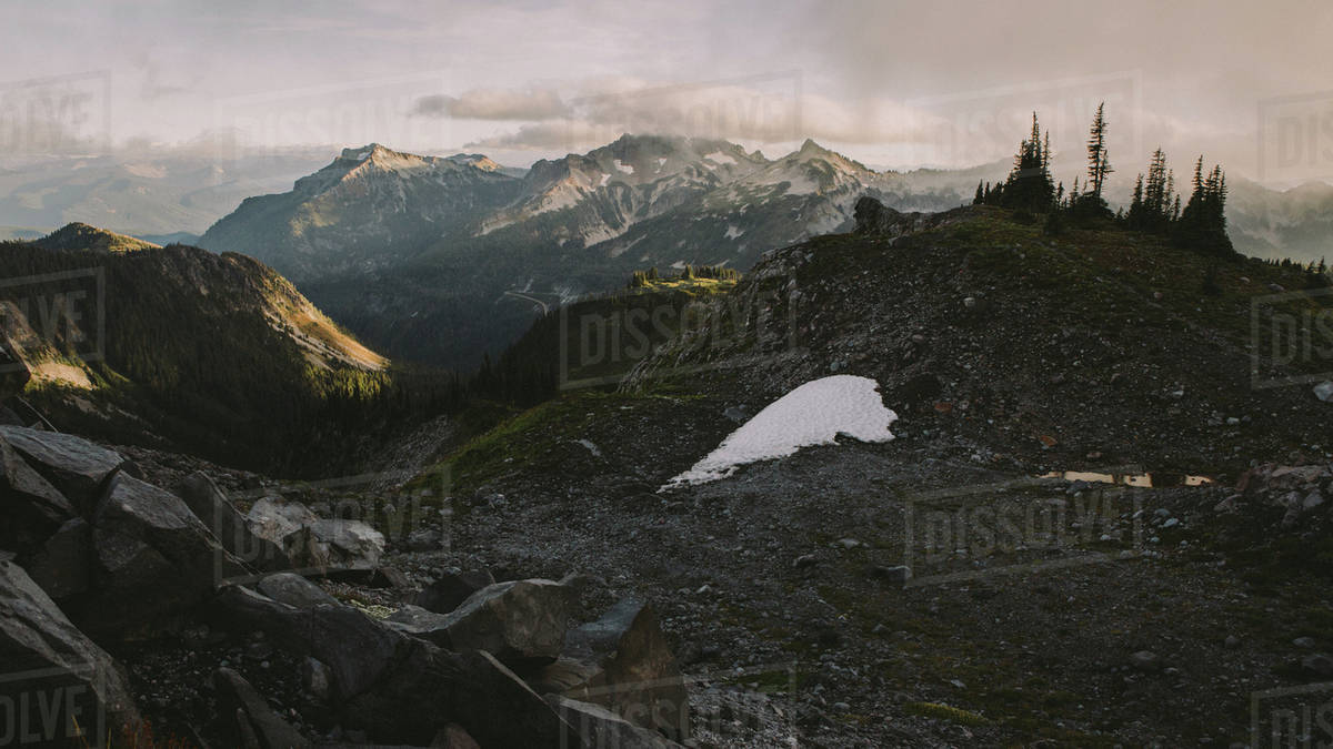 Snow patch in front of mountain view - Royalty-free Stock Photo | Dissolve