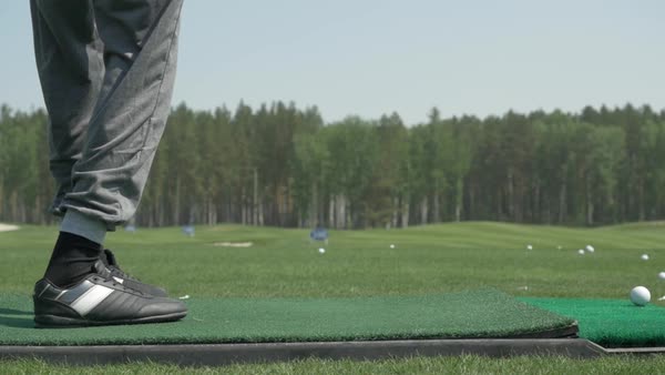 Pro golf player shot ball from sand bunker at course. Section of man ...
