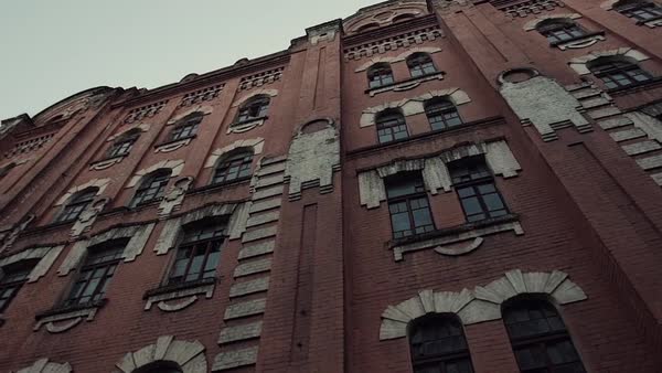 Bottom view of classic old fashioned red brick building, concept of ...