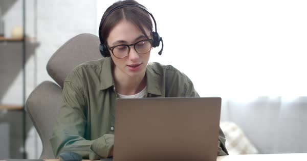 Girl in Headset holding Webcam Webinar using Laptop. Girl student in ...