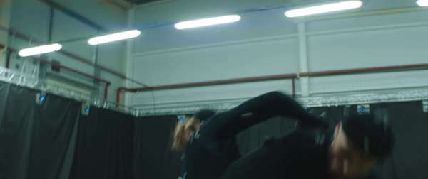 Actors wearing motion capture suits performing some fight moves as game ...
