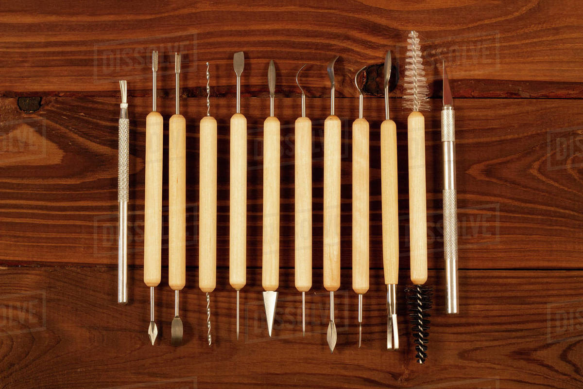 Professional sculpting tool kit for polymer clay and wax on brown ...