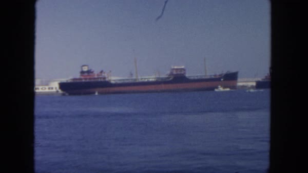 1962: old style oil tanker cargo ship parked in harbor dock. - 4K ...