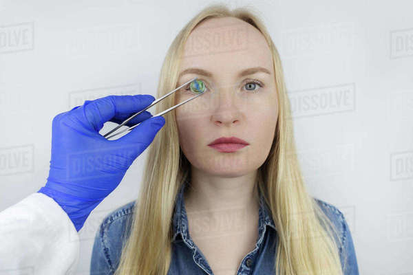 Conceptual shot of an eye crystalline lens replacement. Ophthalmic ...