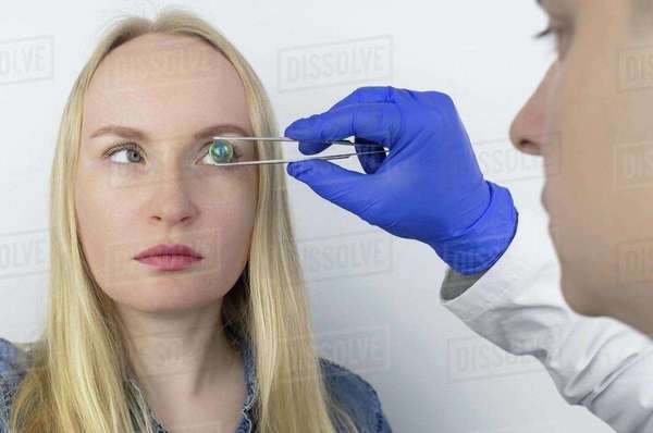 Conceptual shot of an eye crystalline lens replacement. Ophthalmic ...