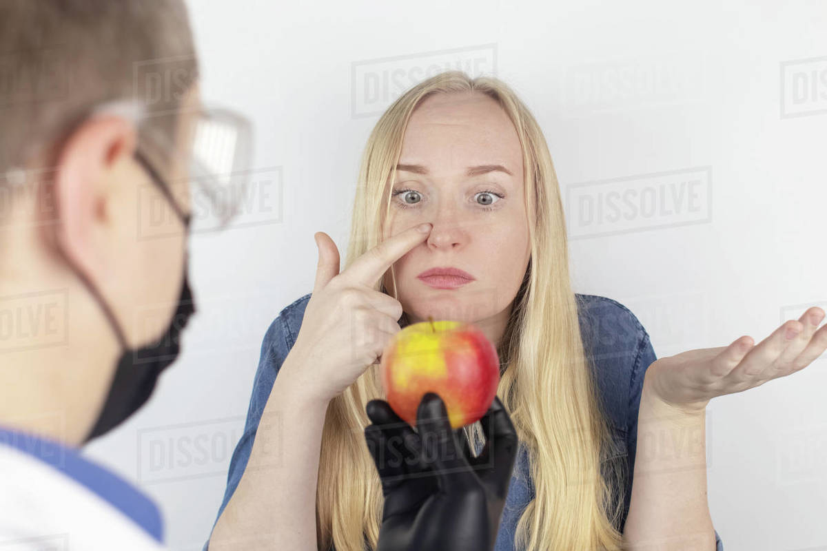 The girl complains to the doctor about the loss of smell. The doctor ...