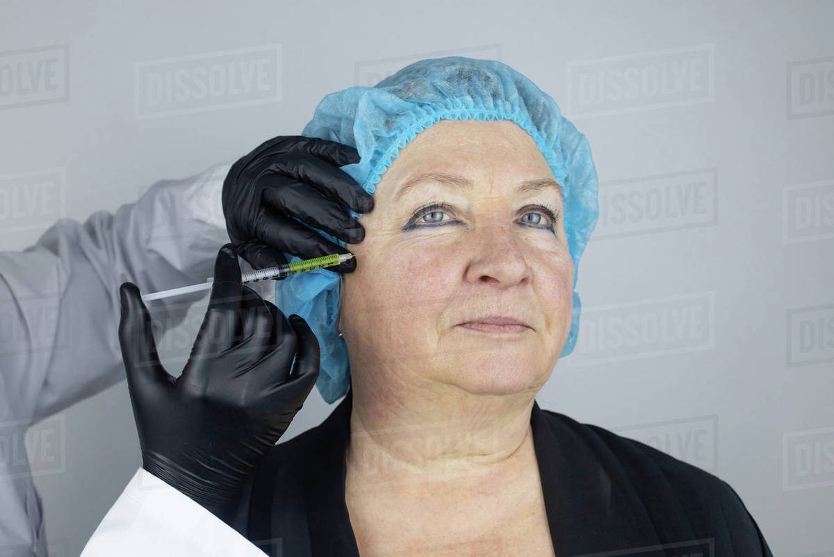 Botulinum toxin injection. Senior woman at the appointment with a ...