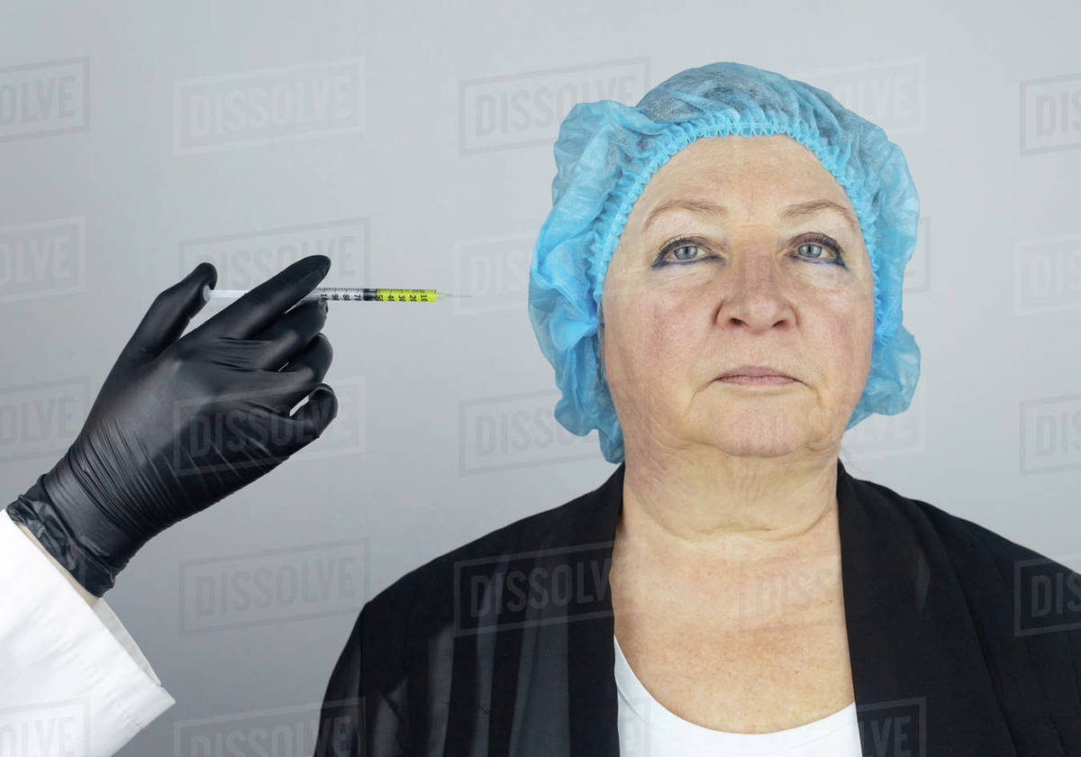 Botulinum toxin injection. Senior woman at the appointment with a ...