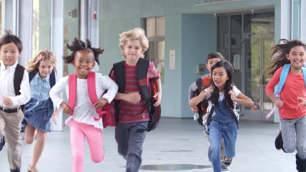 Group of elementary school kids running in a school corridor - 4K ...