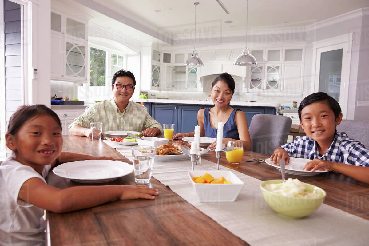Portrait Of Family Eating Meal At Home Together - Royalty-free Stock ...