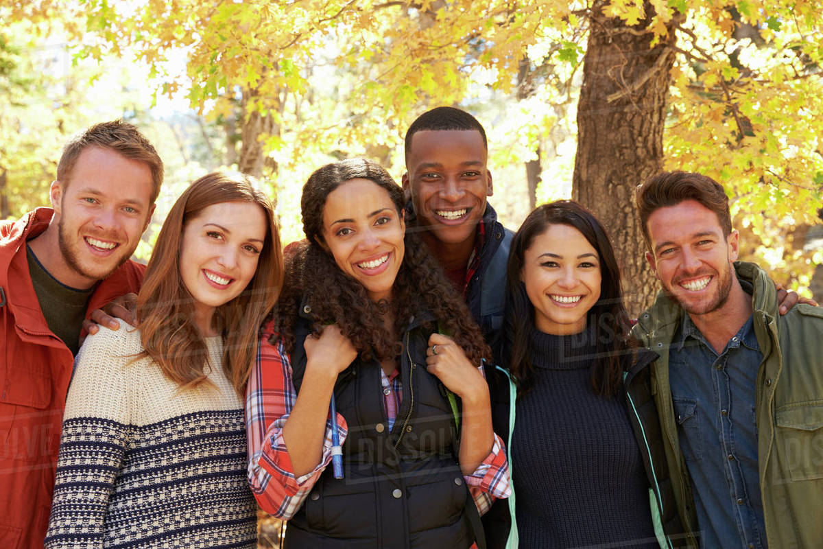 Group portrait of six happy friends in a forest setting - Royalty-free ...