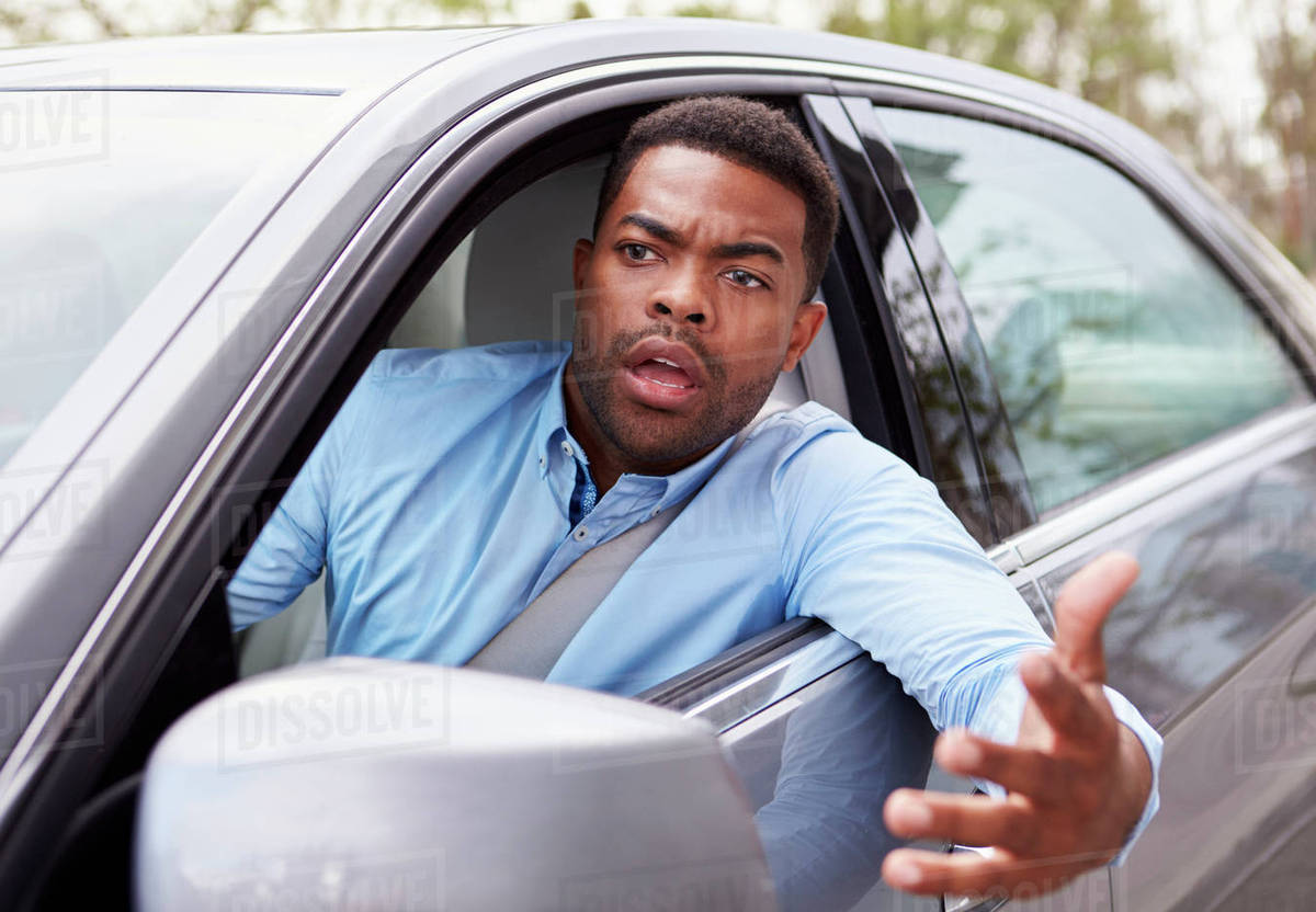 Frustrated African American male driver in car - Royalty-free Stock ...