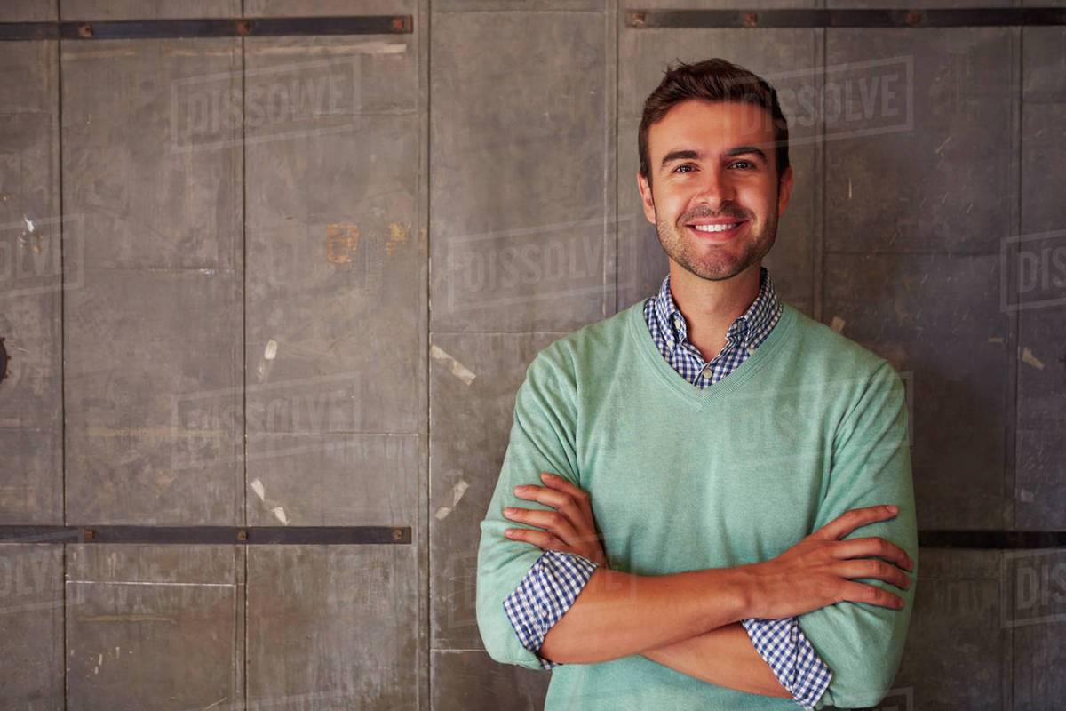 Portrait of male designer standing in modern office - Royalty-free ...