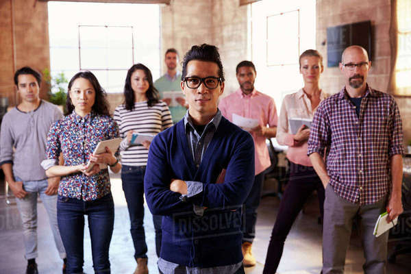 Portrait of staff standing in modern design office - Royalty-free Stock ...