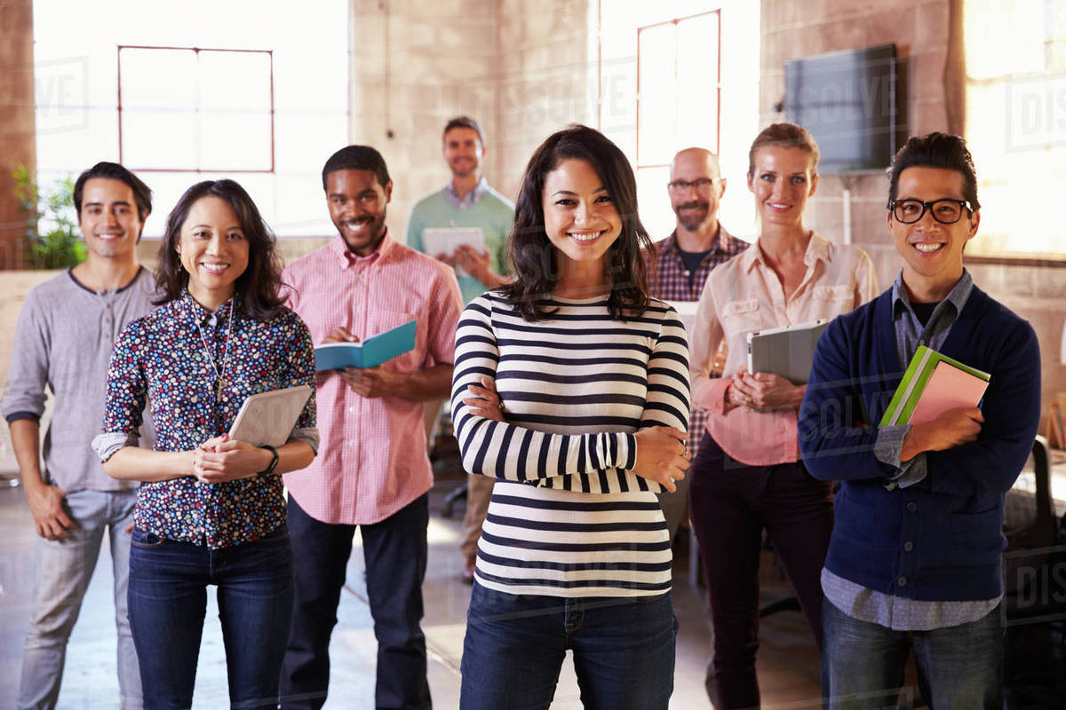 Portrait of staff standing in modern design office - Royalty-free Stock ...