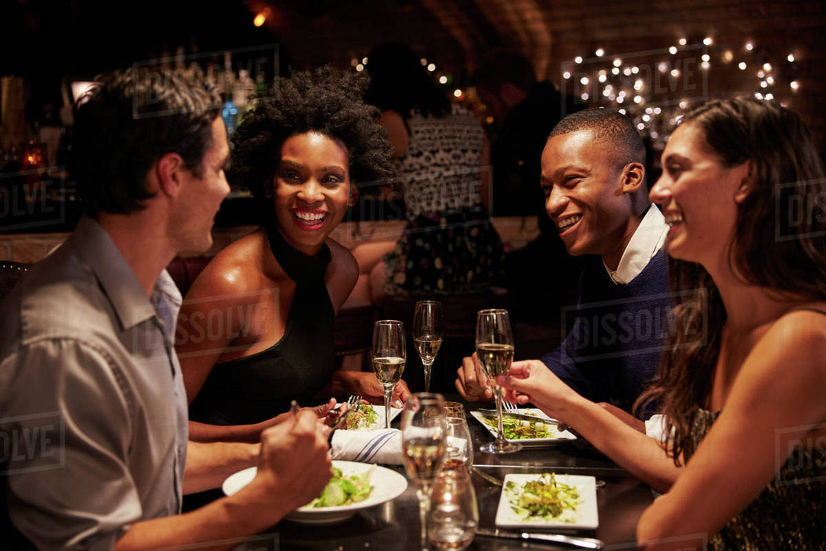 Two couples enjoying meal in restaurant together - Royalty-free Stock ...