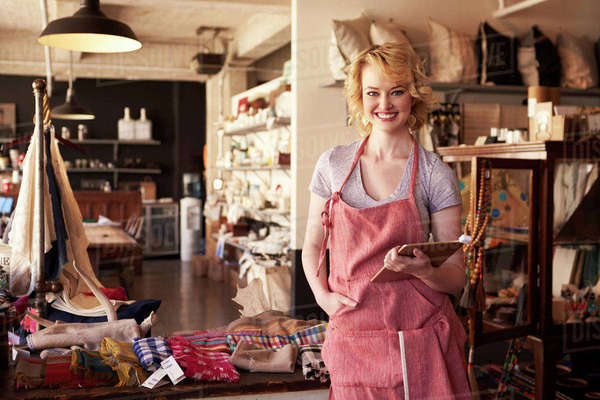 Portrait of female owner of gift store with digital tablet - Stock ...