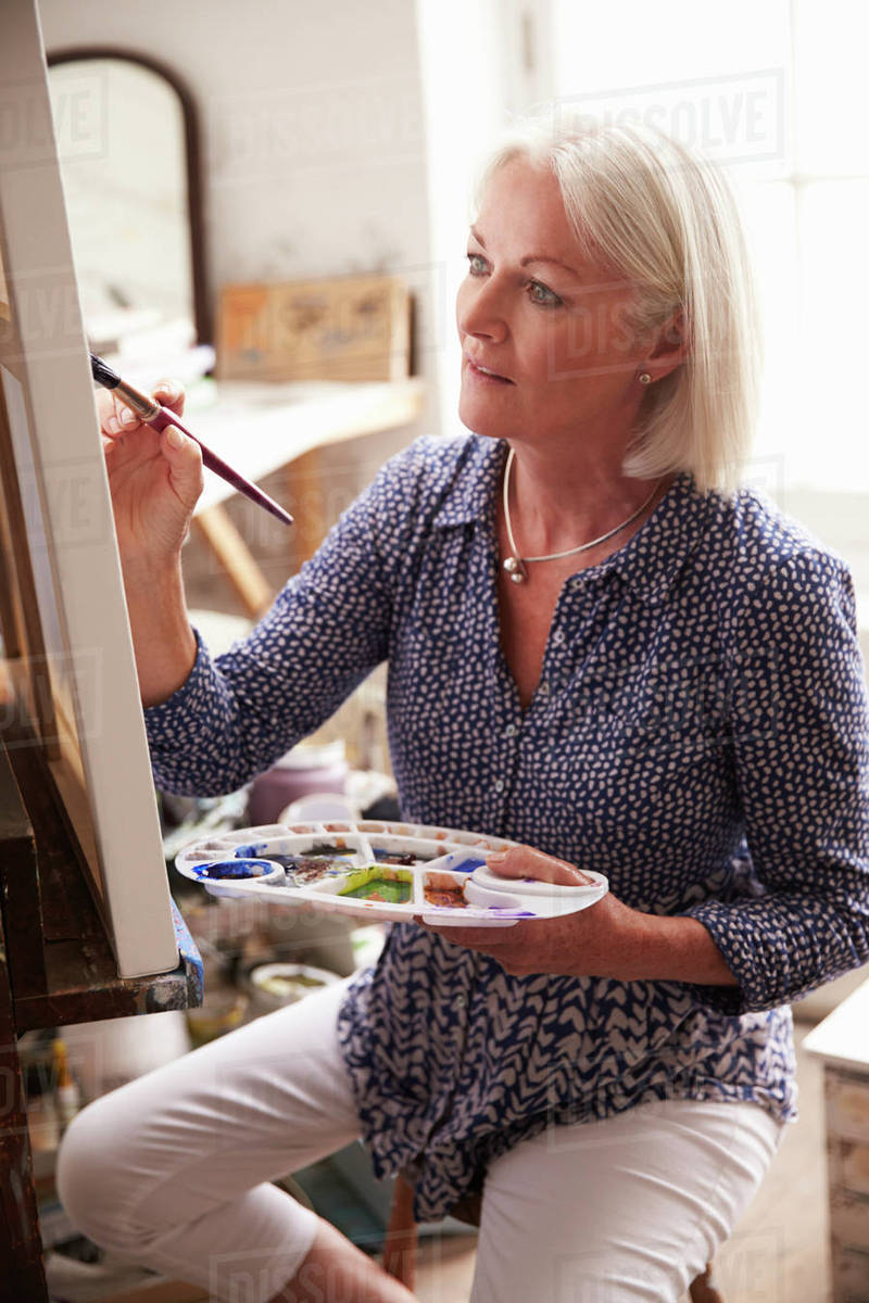 Female Artist Working On Painting In Studio - Royalty-free Stock Photo ...