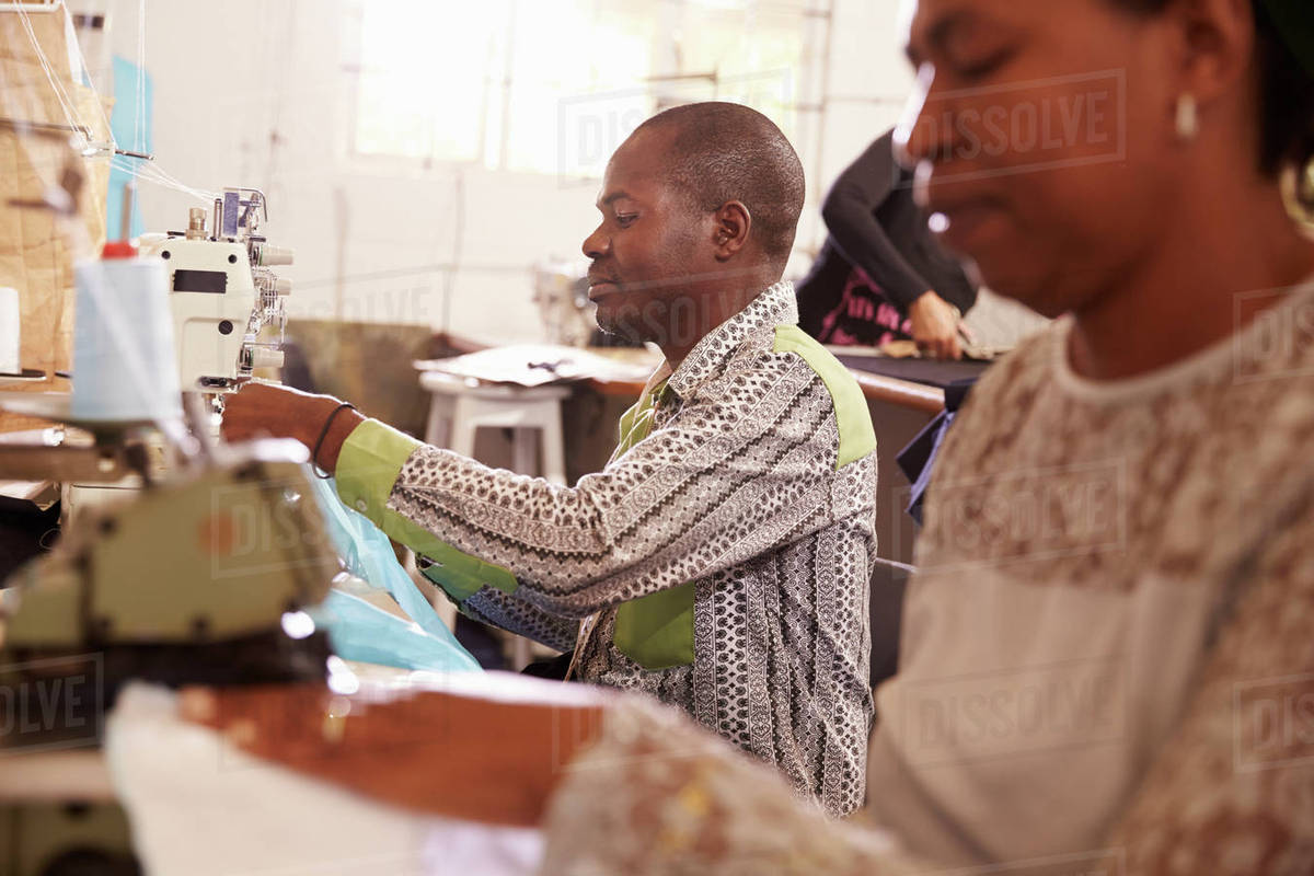People sewing at a community project workshop, South Africa - Royalty ...