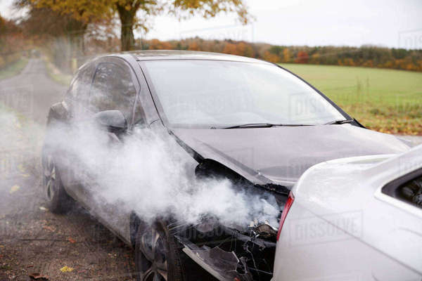 Close up of damaged car after road accident - Stock Photo - Dissolve
