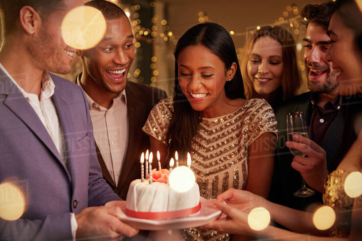 Group of friends celebrating birthday with party at home - Royalty-free ...