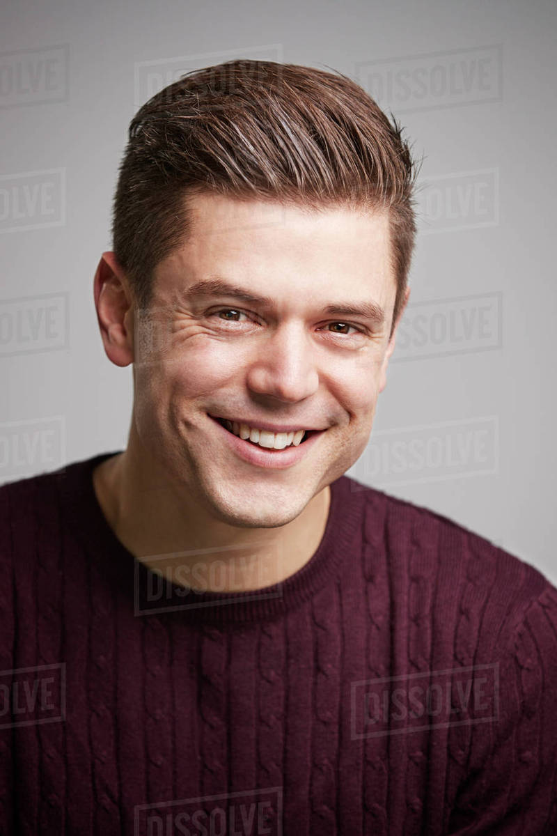 Portrait of a smiling young white man looking to camera - Royalty-free ...