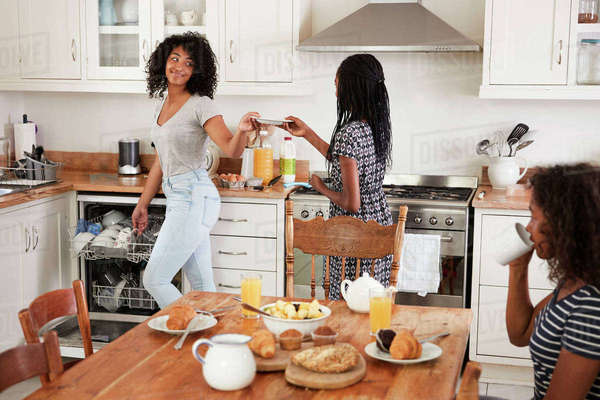 Three Teenage Girls Eating Breakfast In Kitchen Together - Royalty-free ...