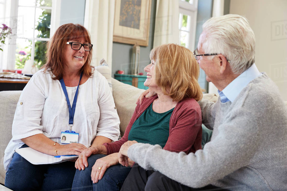 Female Support Worker Visits Senior Woman At Home - Royalty-free Stock ...