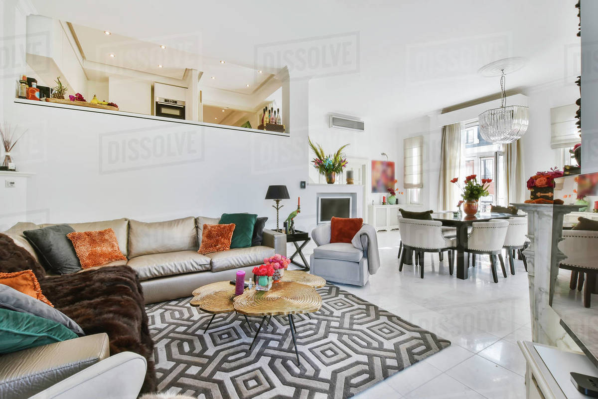 Simple expensive interior of living room with carpet and beige sofa ...