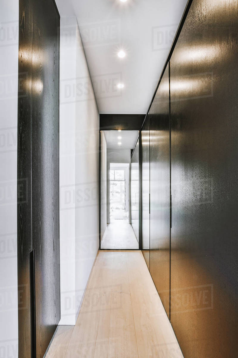 Interior of modern flat in minimal style with narrow empty corridor ...
