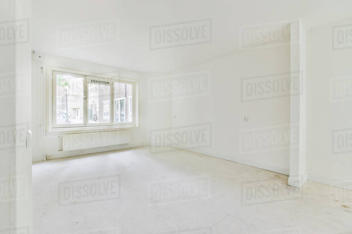 White room with windows in an elegant residential building - Royalty ...