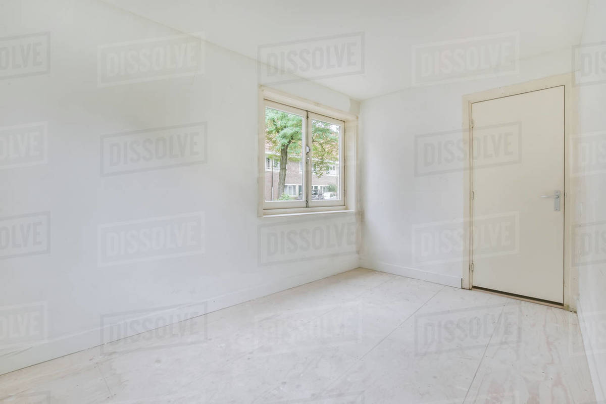White room with windows in an elegant residential building - Royalty ...
