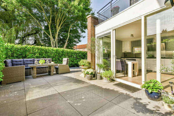 Courtyard of a modern and stylish house with glass doors - Stock Photo ...