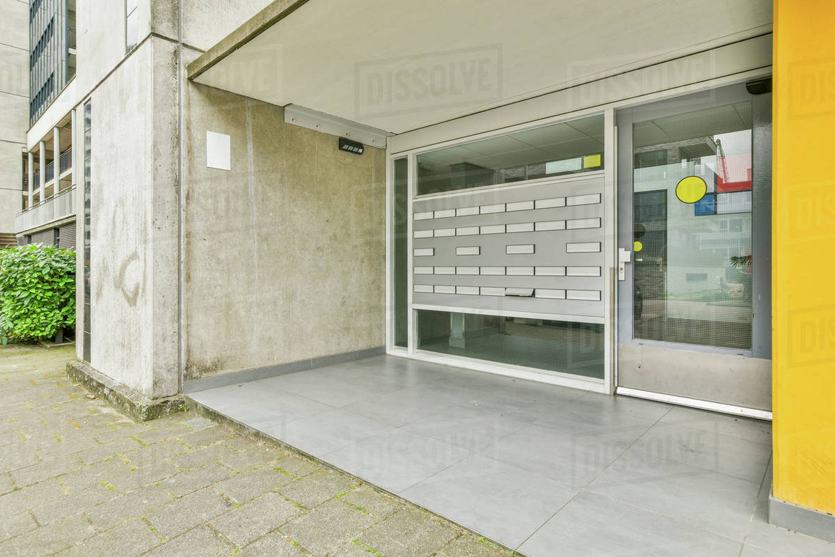 Residential building front door with white glass door - Stock Photo ...