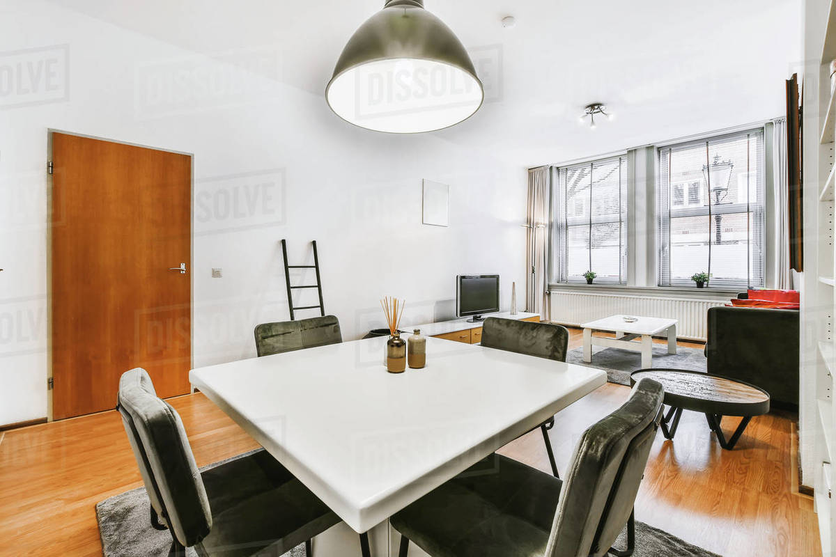 Modern dining room in a luxury house with individual design - Royalty ...