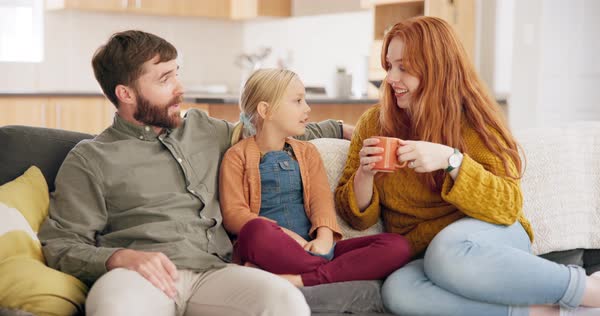 Conversation, relax and parents bonding with their kid on a sofa in the ...