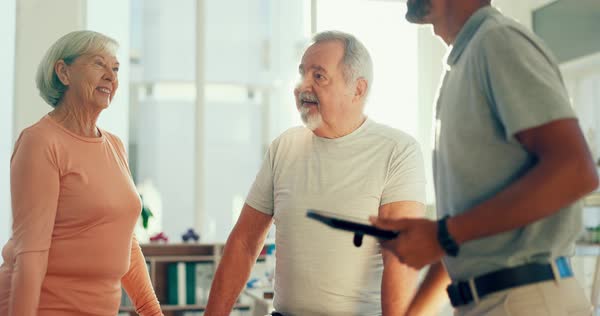 Physiotherapy, handshake and man on tablet with elderly couple for ...