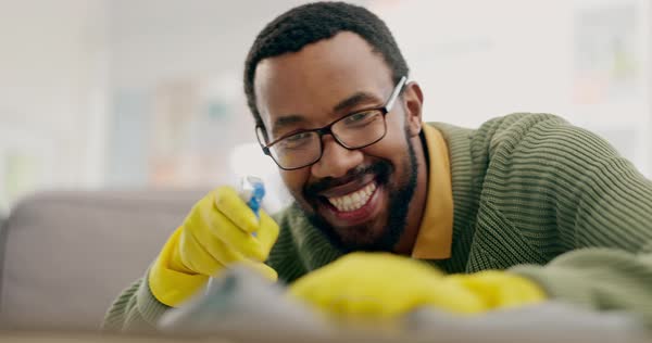 Black man, spray bottle and cleaning table in house living room for ...