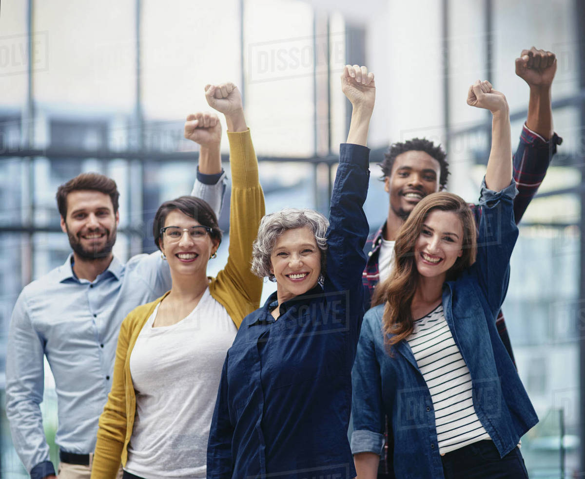 Celebration, diversity and business people with a fist in office for ...