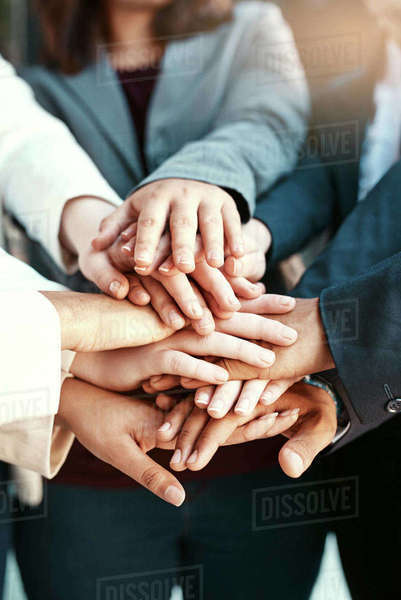Closeup, business and team with hands, stack and collaboration with ...