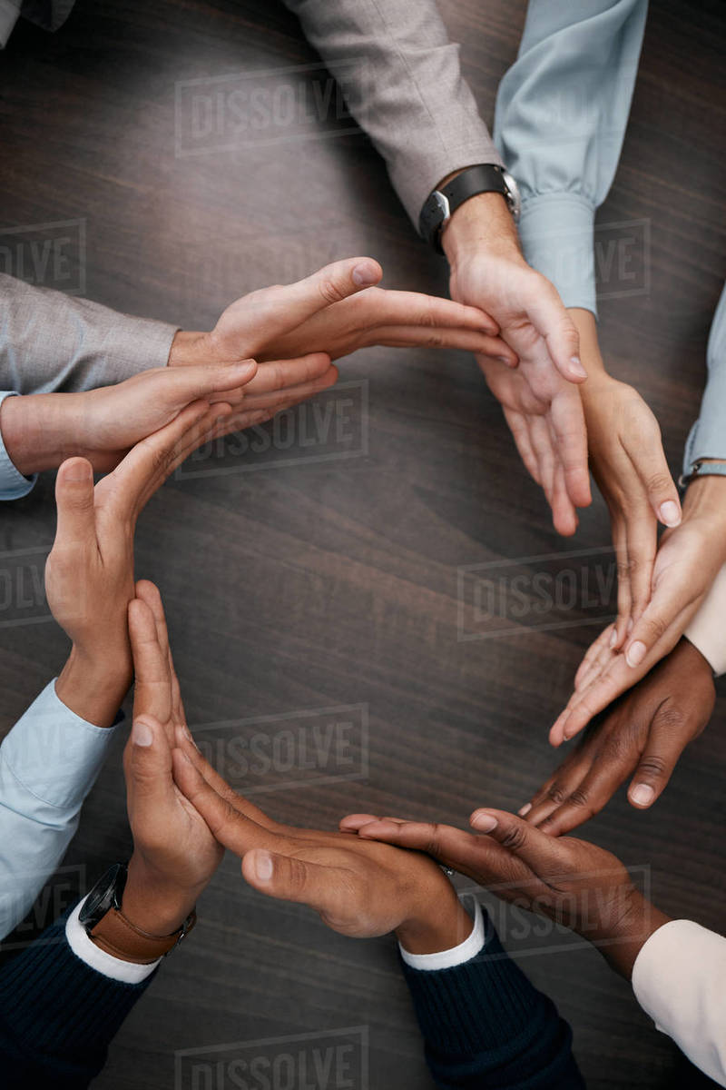 Hands, teamwork and synergy with business people in a circle or huddle ...